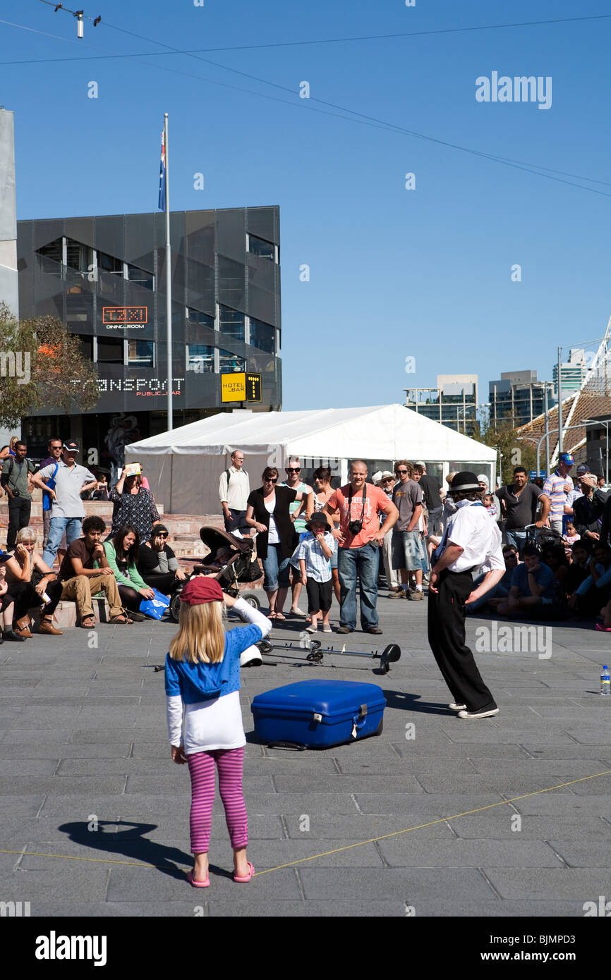 Watching an outdoor performer High Resolution Stock Photography and ...