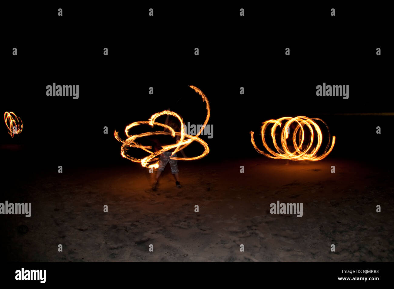 Twirling fire sticks hi-res stock photography and images - Alamy