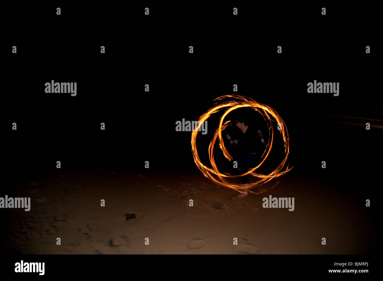 FIRE TWIRLING ON MOOLOOLABA BEACH Stock Photo - Alamy