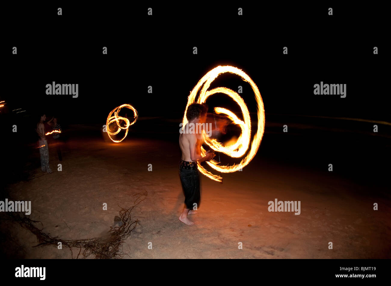 Twirling Fire Sticks High Resolution Stock Photography and Images - Alamy