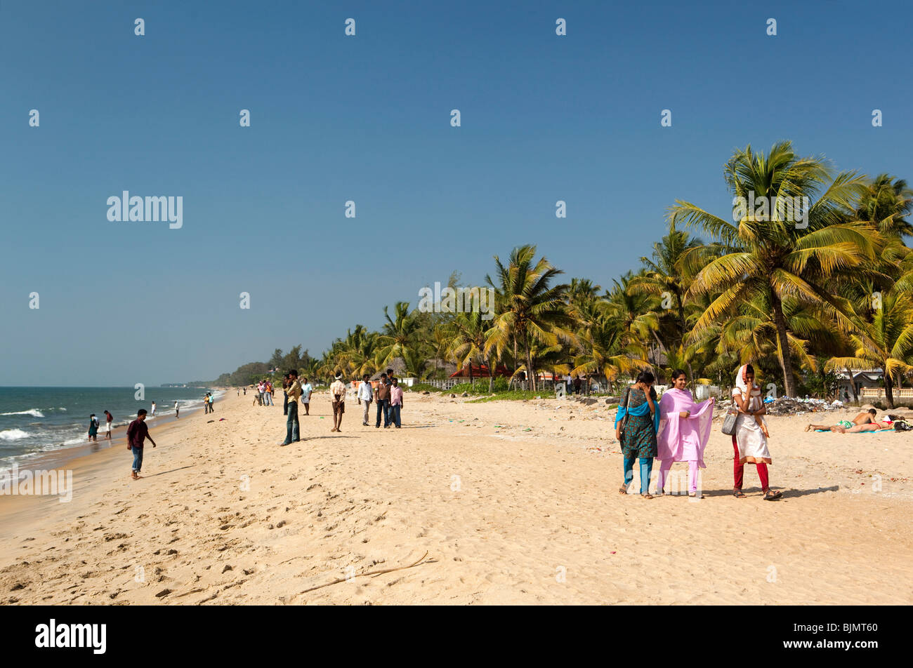 India, Kerala, Vypeen Island, Cherai Beach Indian tourists walking ...