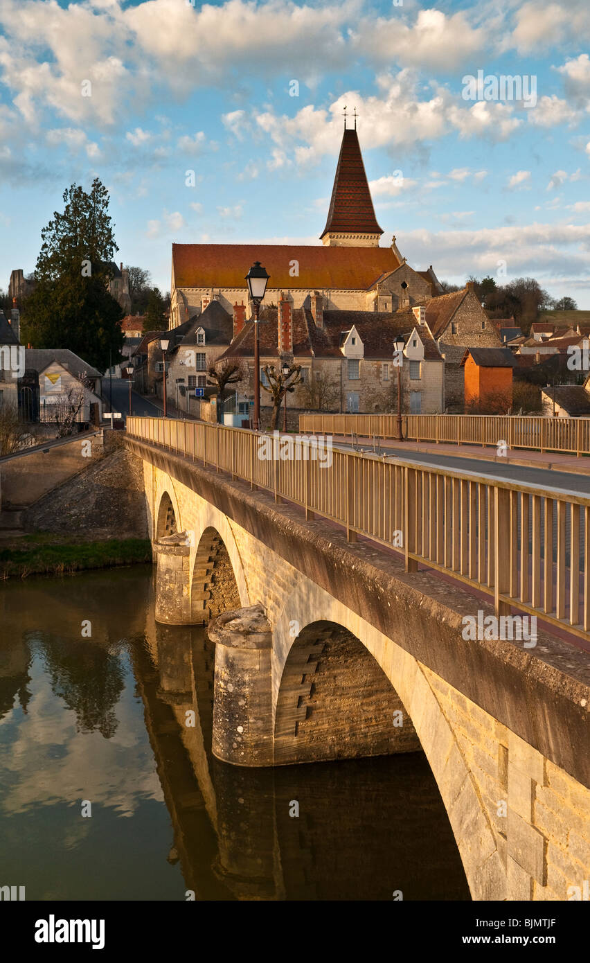 Preuilly-sur-Claise abbey church and river bridge - France Stock Photo ...
