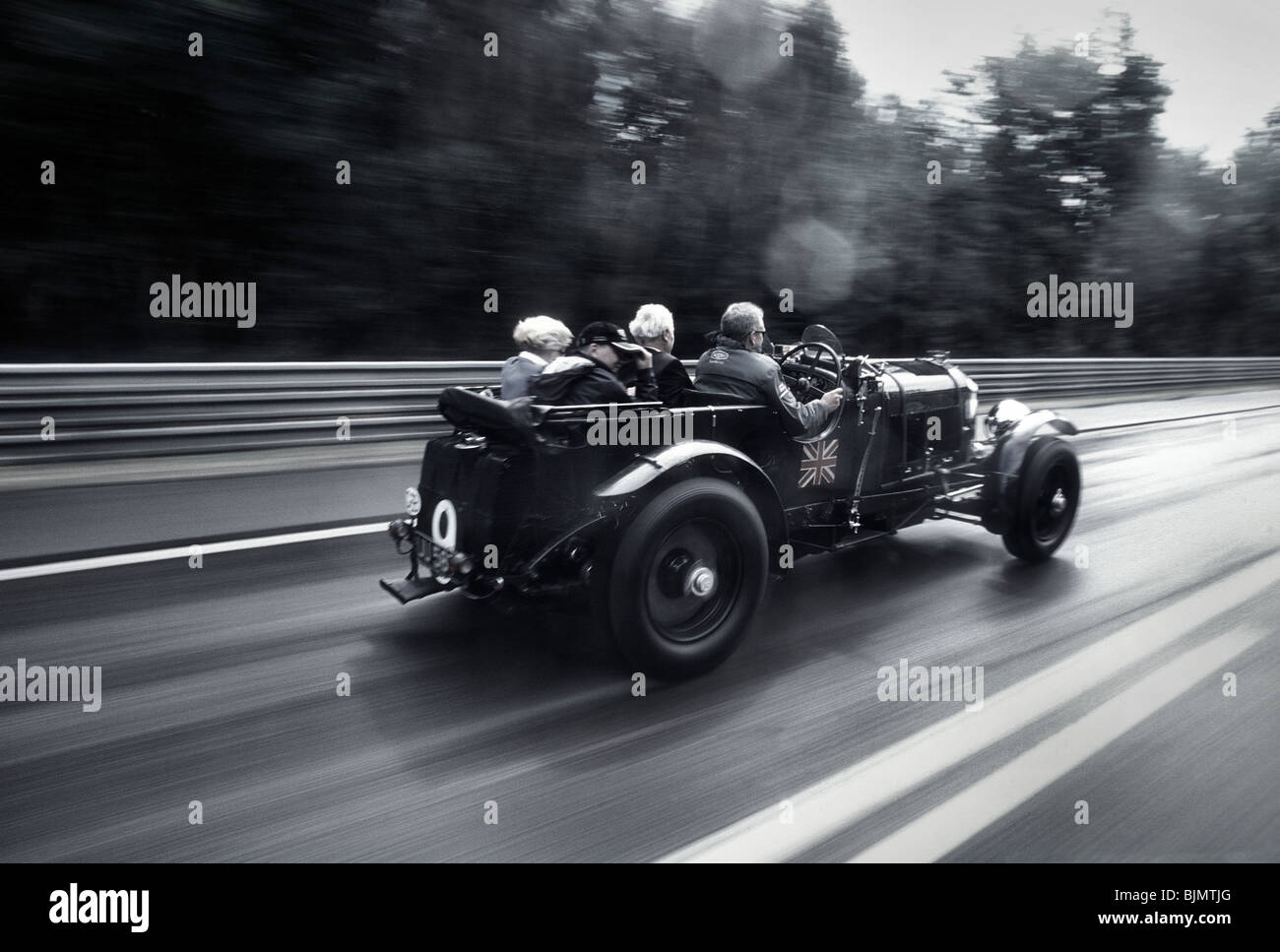 Vintage Bentley driving around the Le Mans motor racing circuit in the ...