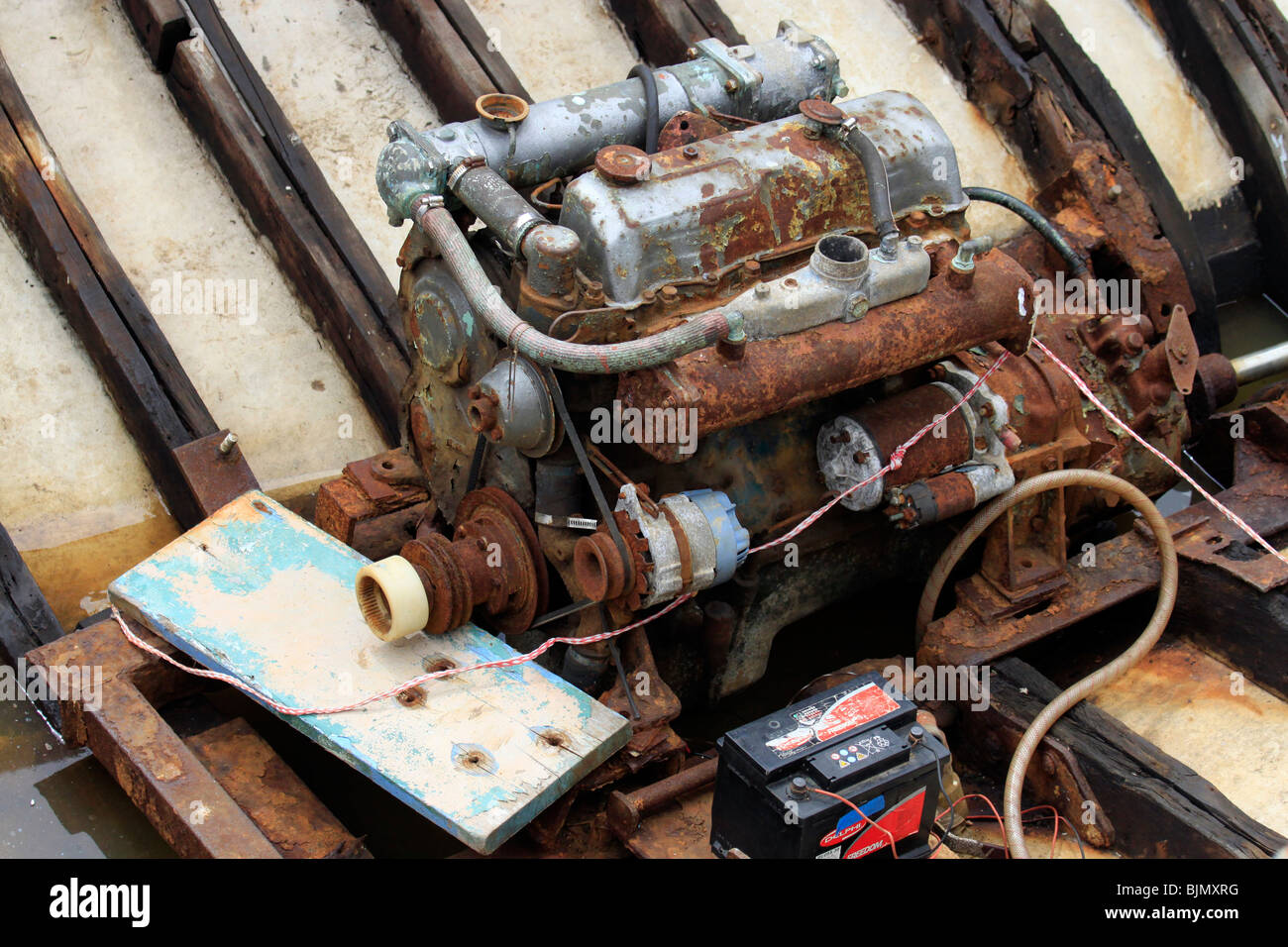 Old rusty engine in waterlogged boat Stock Photo - Alamy