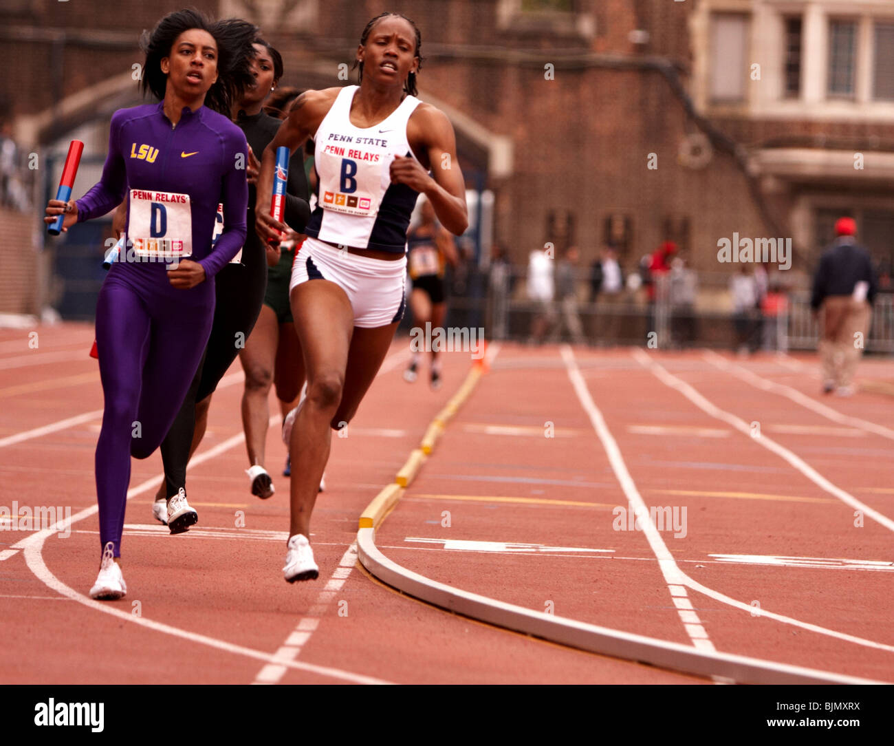 Latavia Thomas of LSU, anchor leg for the Lady Tigers, completing the ...