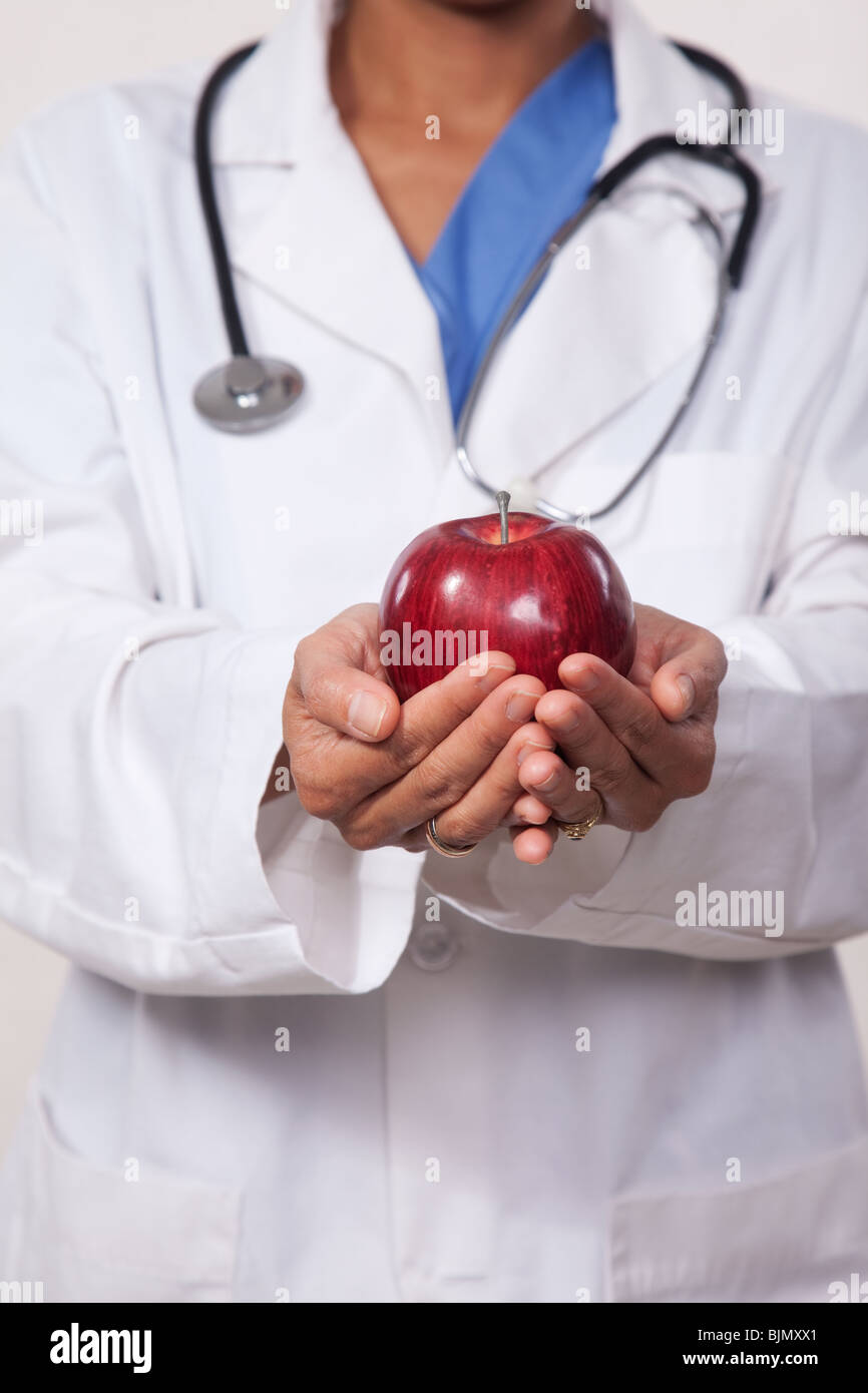 Doctor recommending healthy fruit diet Stock Photo - Alamy