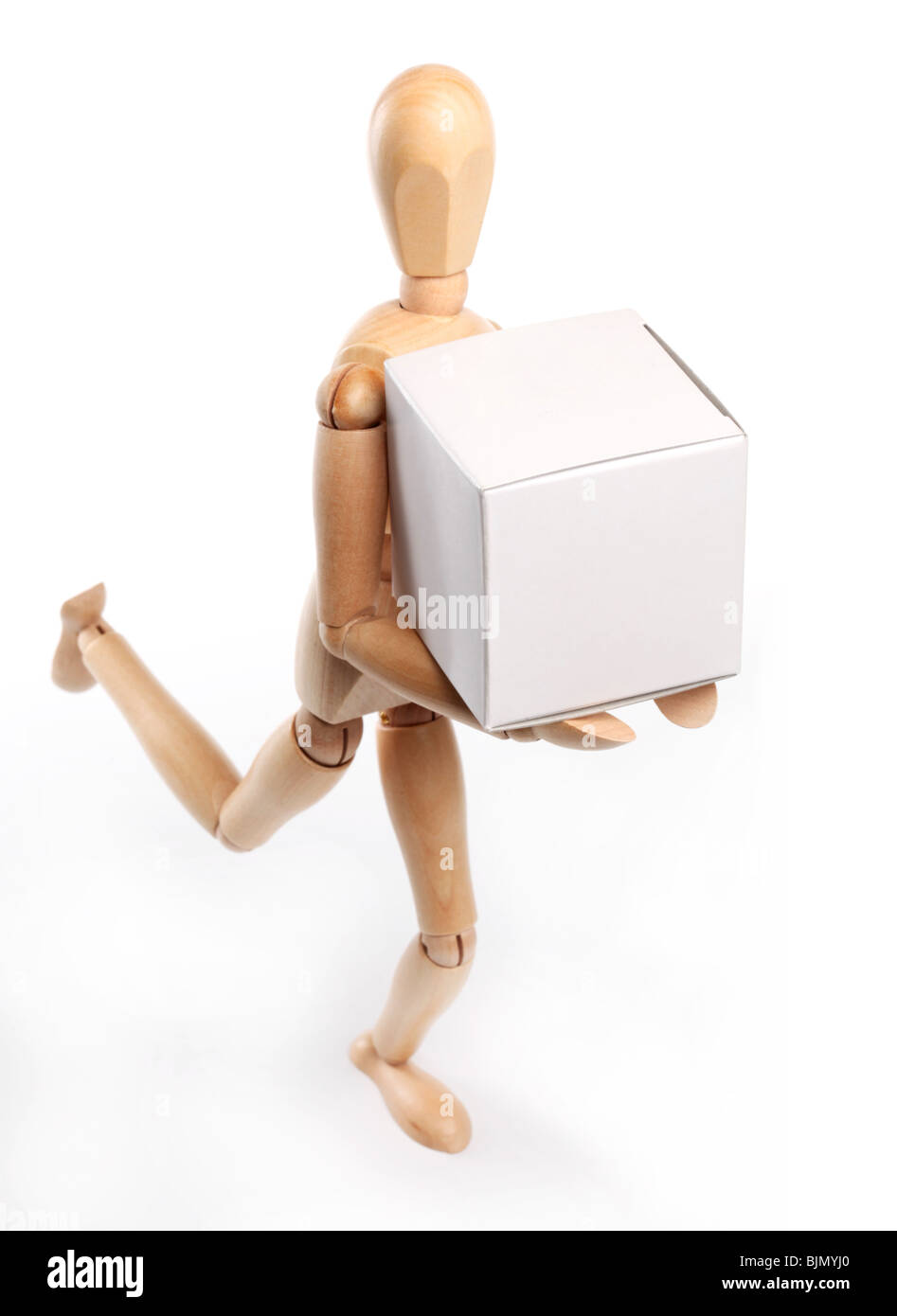 wooden man running with a white box Stock Photo - Alamy