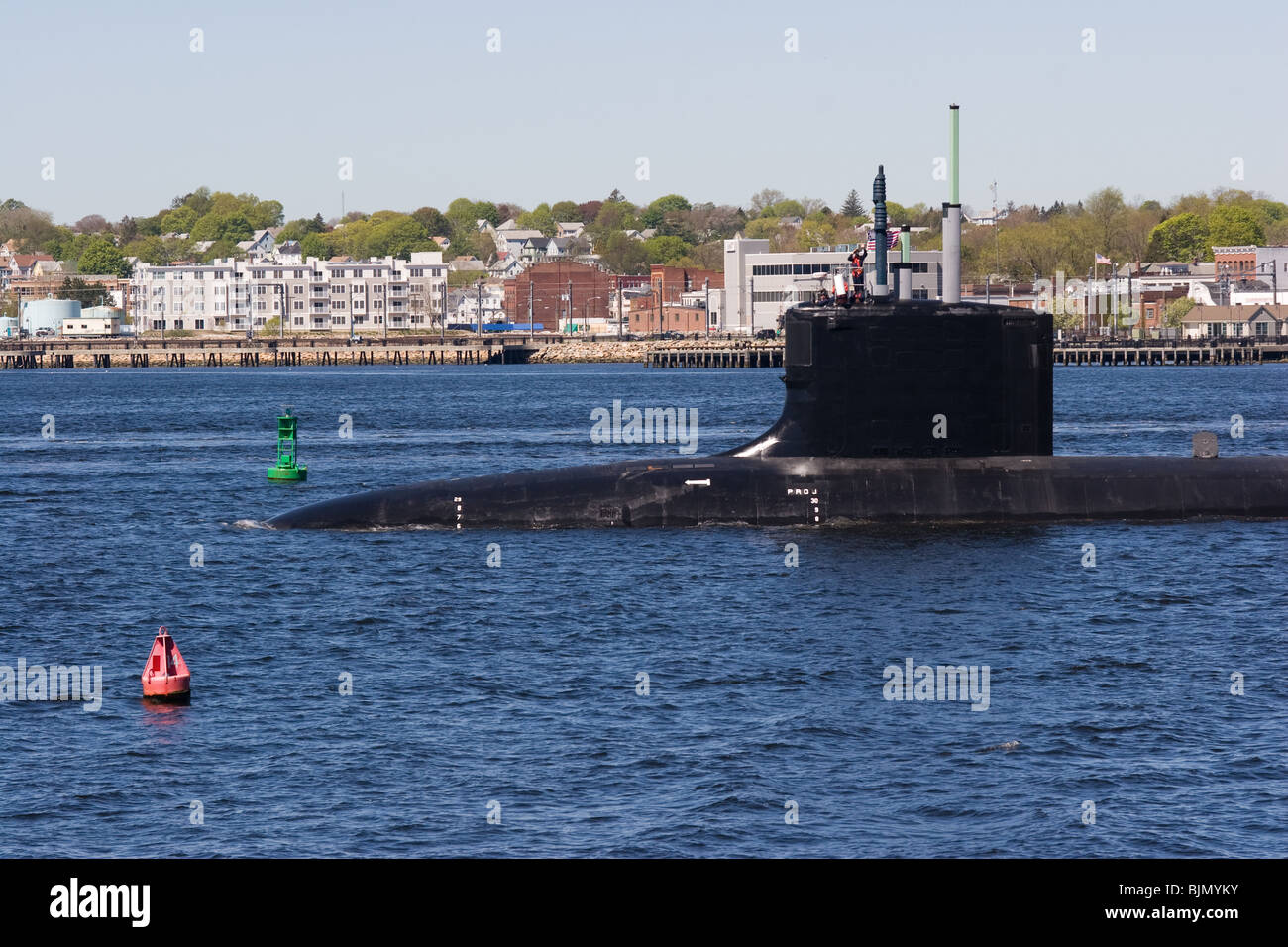 A US Navy Virginia class fast attack submarine passes by channel ...