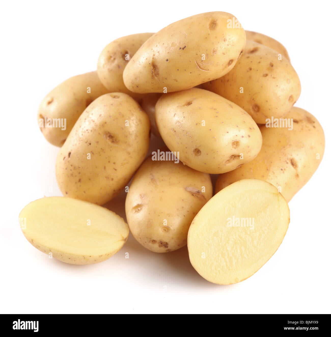Yellow potatoes with sections on a white background Stock Photo - Alamy