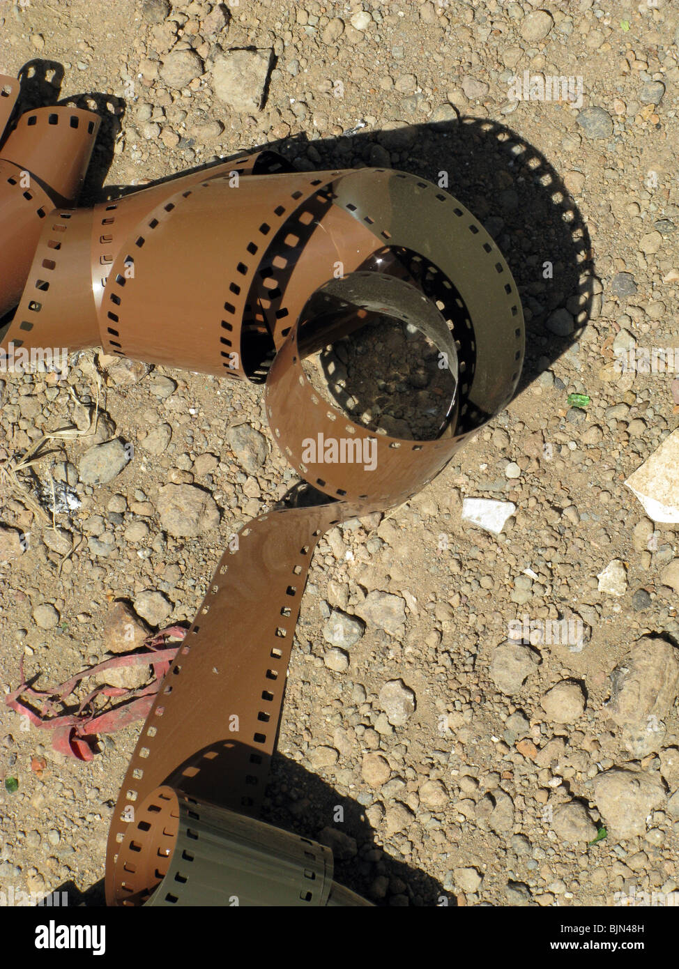 dirty roll of camera negative film in field Stock Photo - Alamy