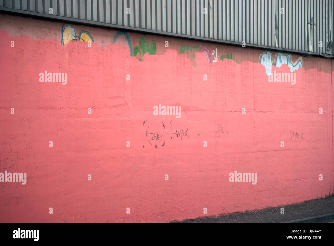 Painted-out graffiti on boarded-up industrial premises in Edinburgh ...