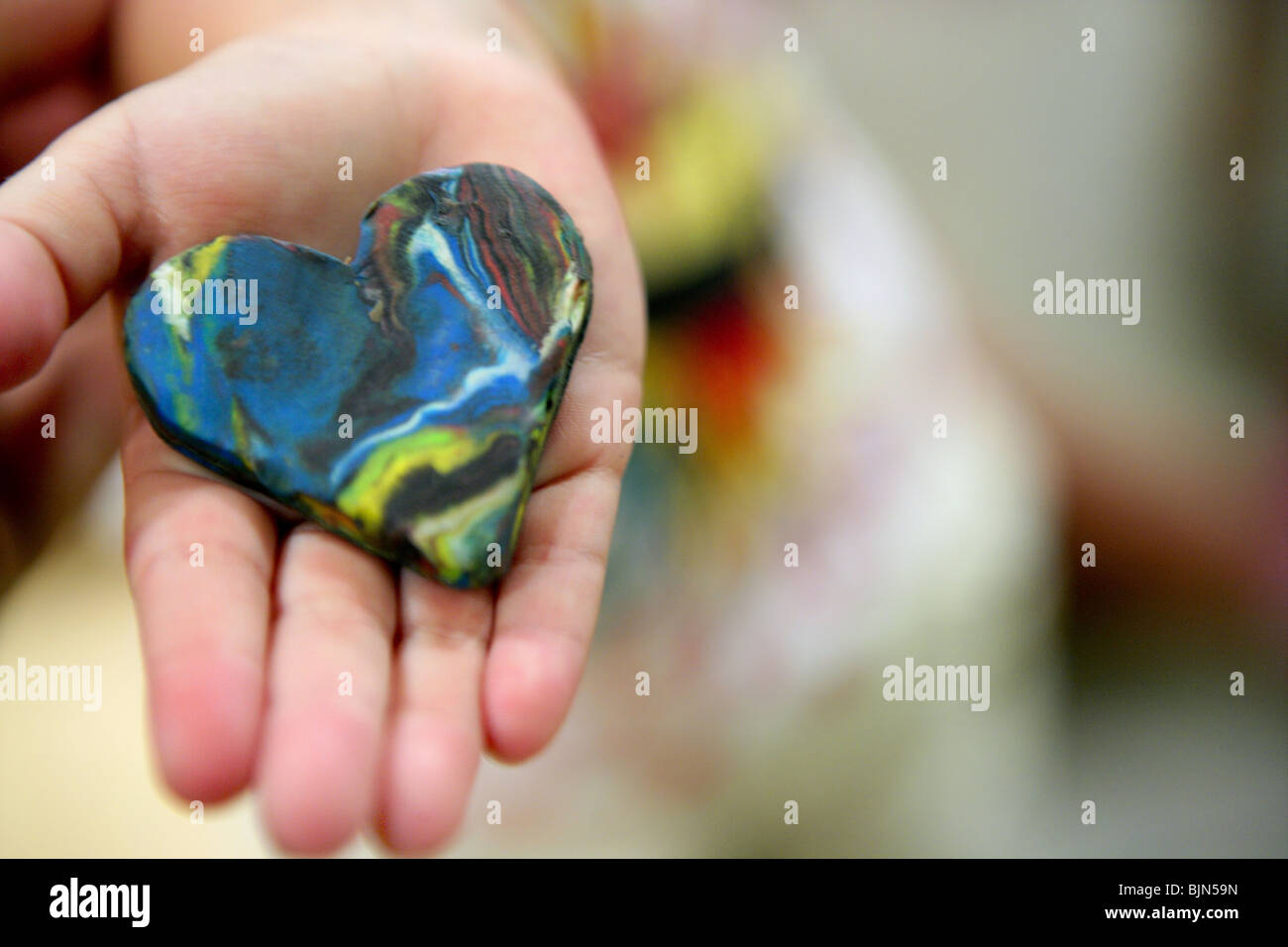 Plasticine brown and blue abstract heart artwork Stock Photo - Alamy