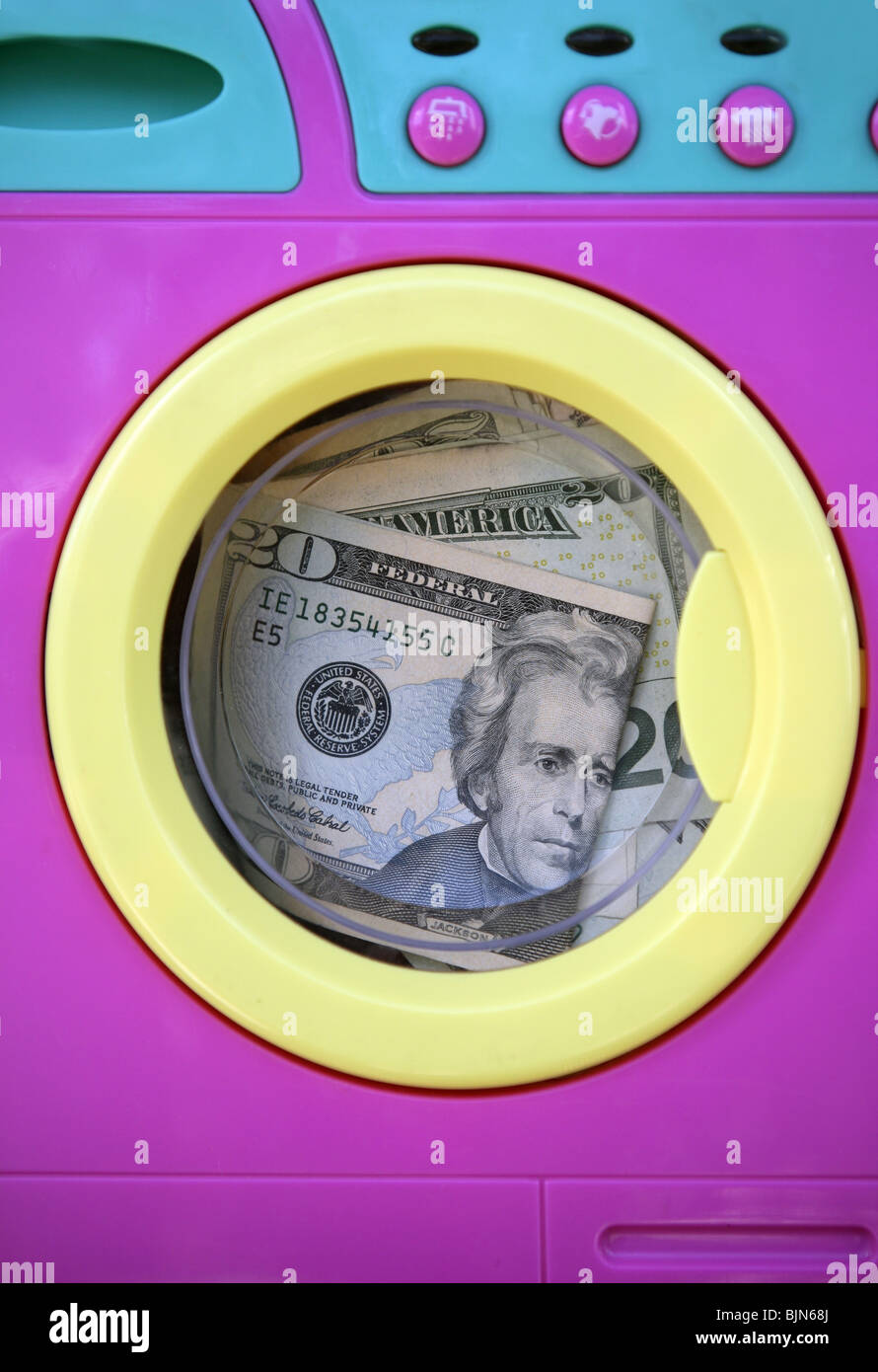 Cleaning black money dollar metaphor, laundry toy wahing machine Stock ...