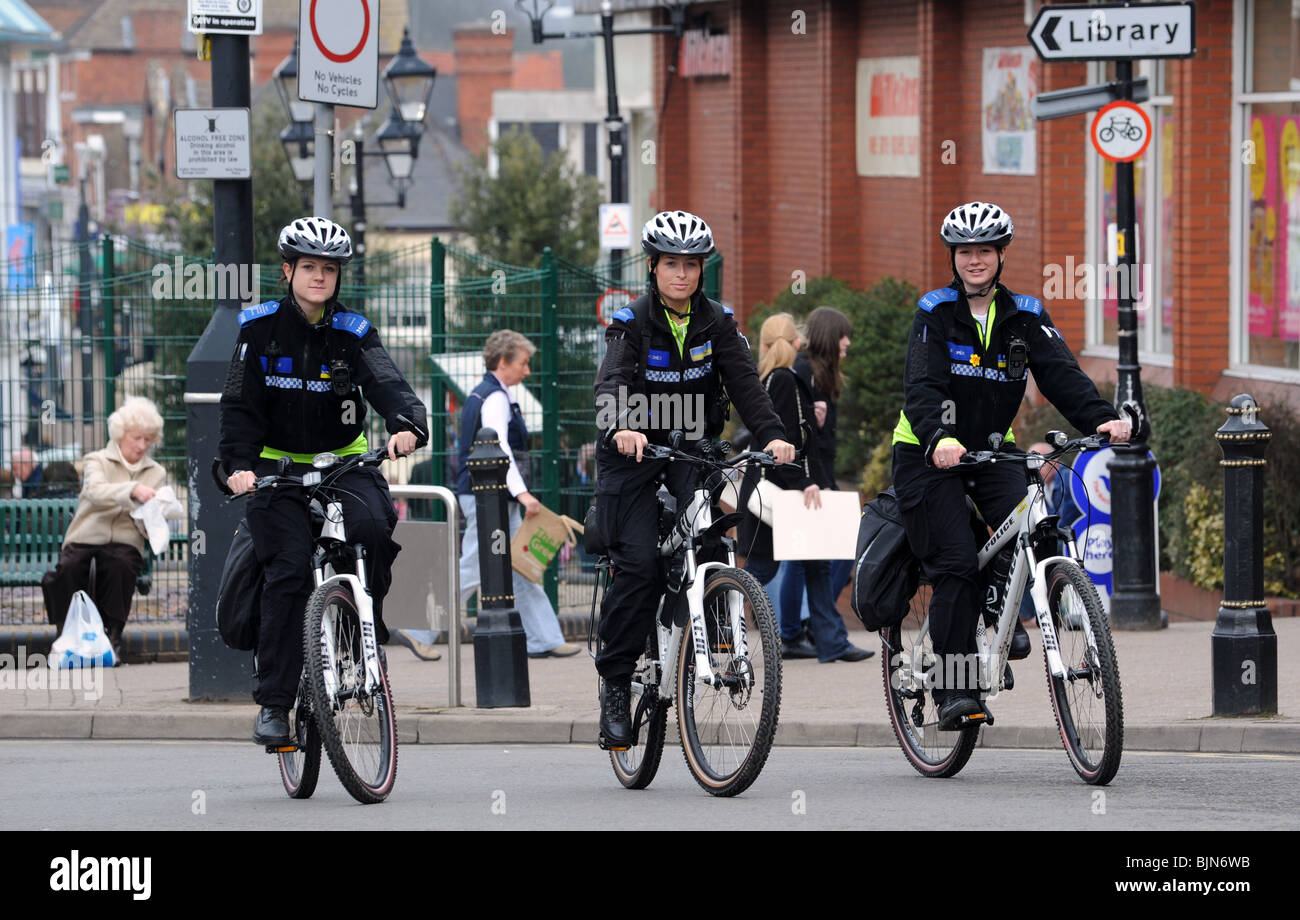Three Police Community Support Officers patrolling on mountain bikes in ...