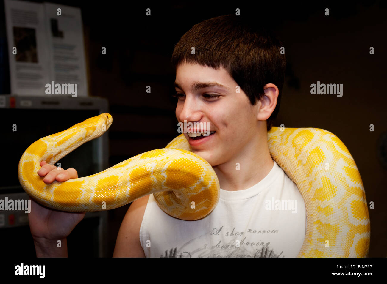 Boy holding a snake hi-res stock photography and images - Alamy