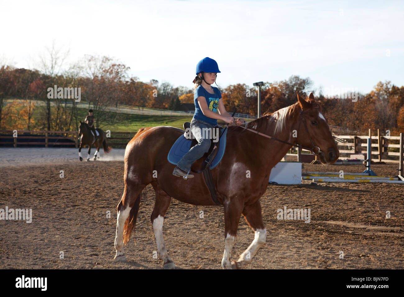 KENTUCKY HORSE FARM AND KID LEARNING HORSEBACK RIDING. USA Stock Photo ...