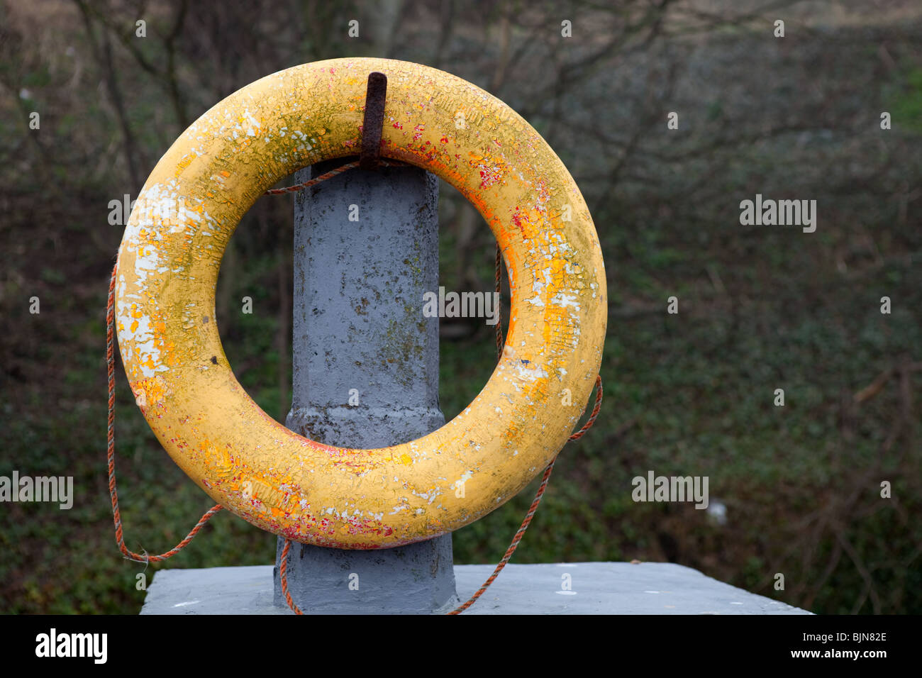 A faded yellow life ring Stock Photo - Alamy