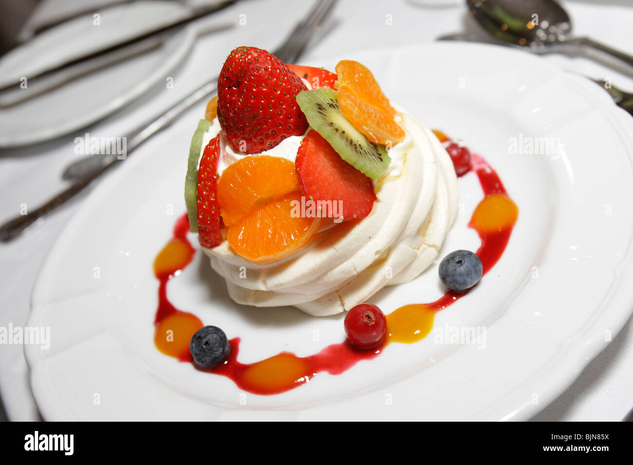 A meringue and fresh fruit dessert Stock Photo - Alamy