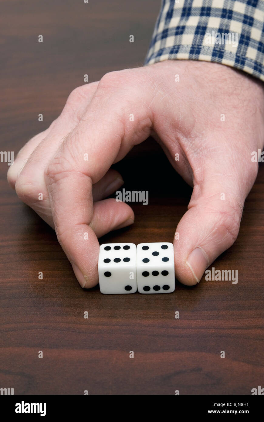 hand holding dice Stock Photo - Alamy