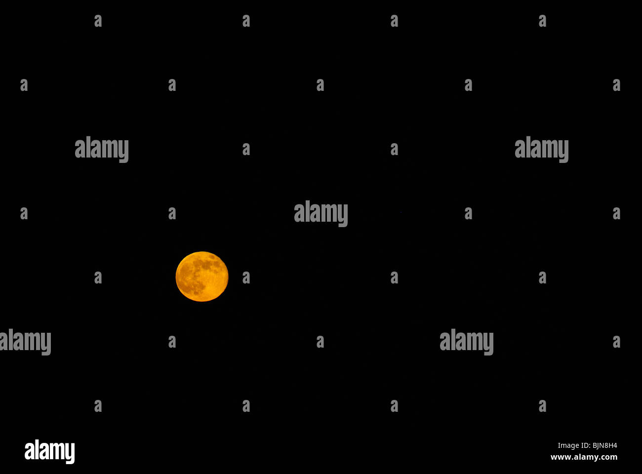 Full moon over Death Valley during one evening Stock Photo - Alamy