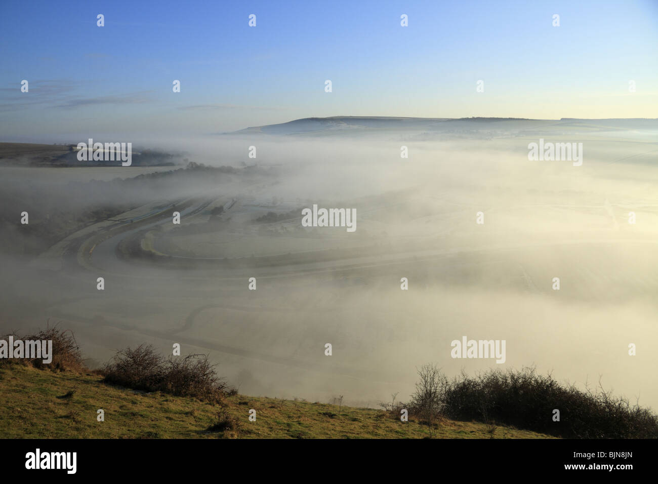 Looking west across the mist shrouded Cuckmere Valley near Alfriston ...