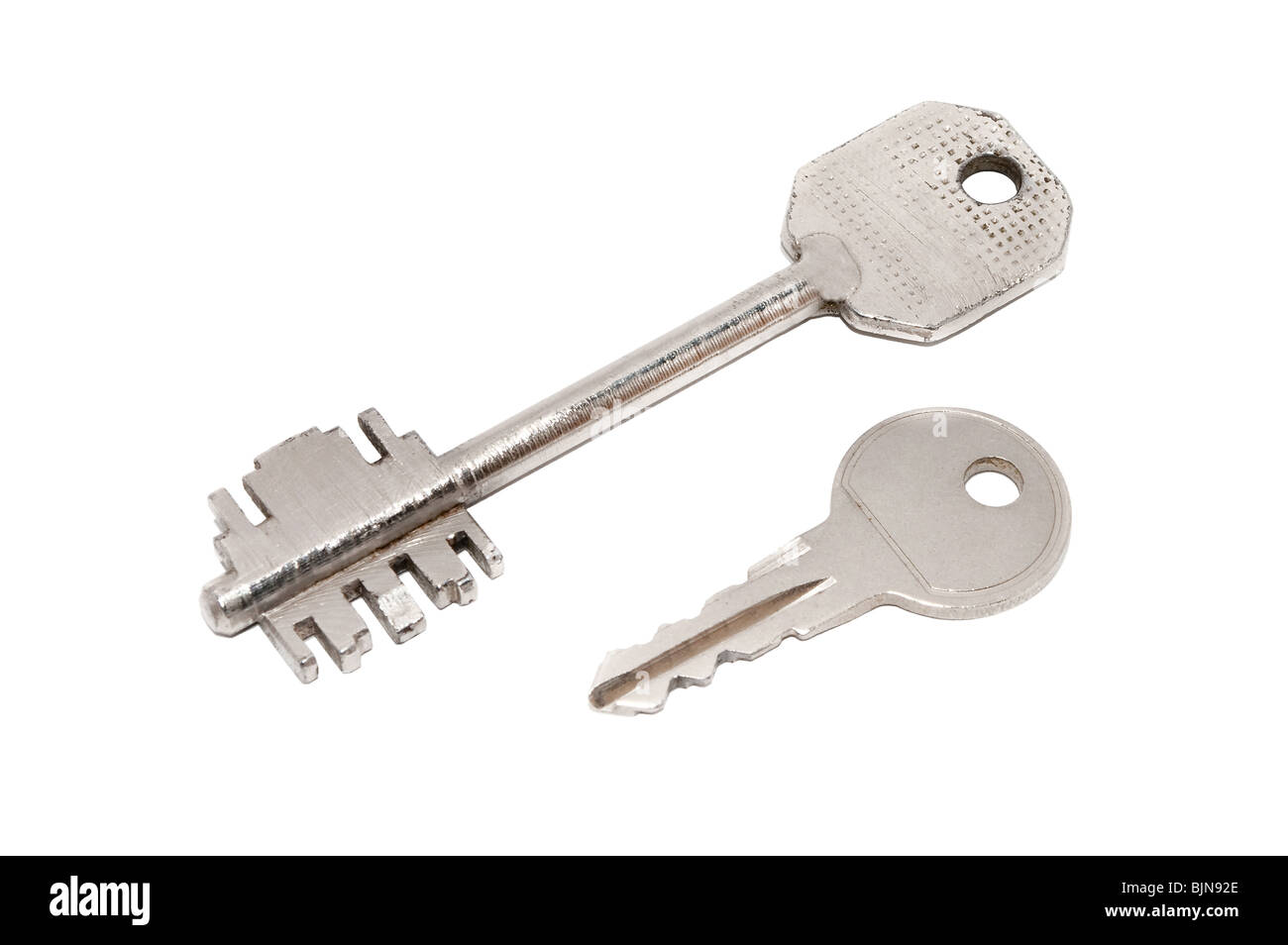 Two different kind of old fashioned keys isolated on white background ...