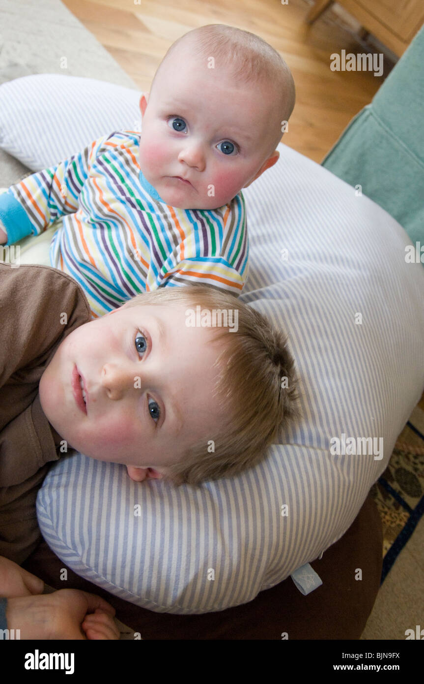 Boy with baby brother Stock Photo - Alamy