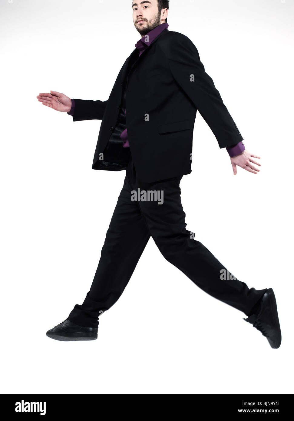 strange man on studio isolated white background jumping running Stock ...