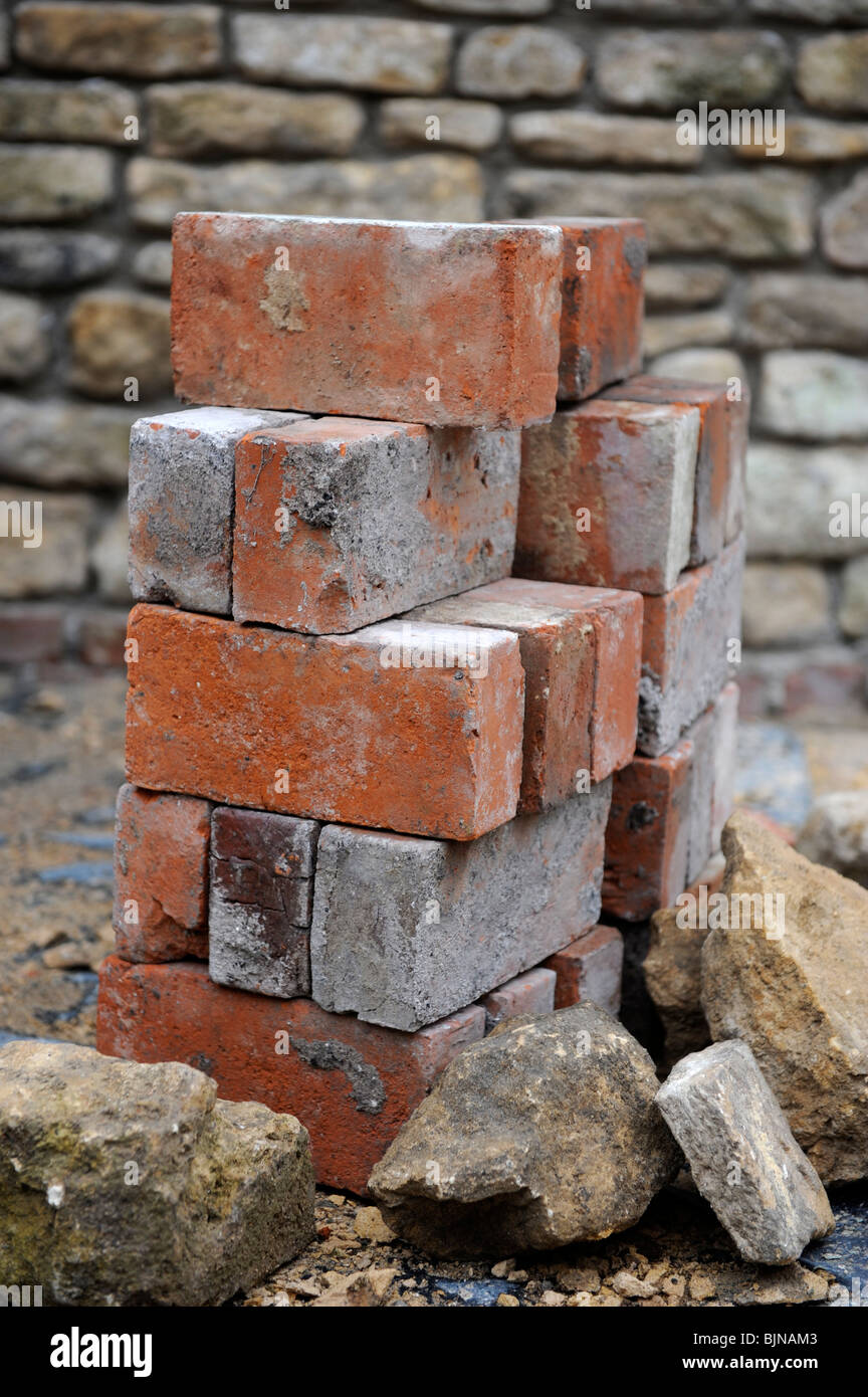 Reclaimed building materials including red bricks used to build a ...