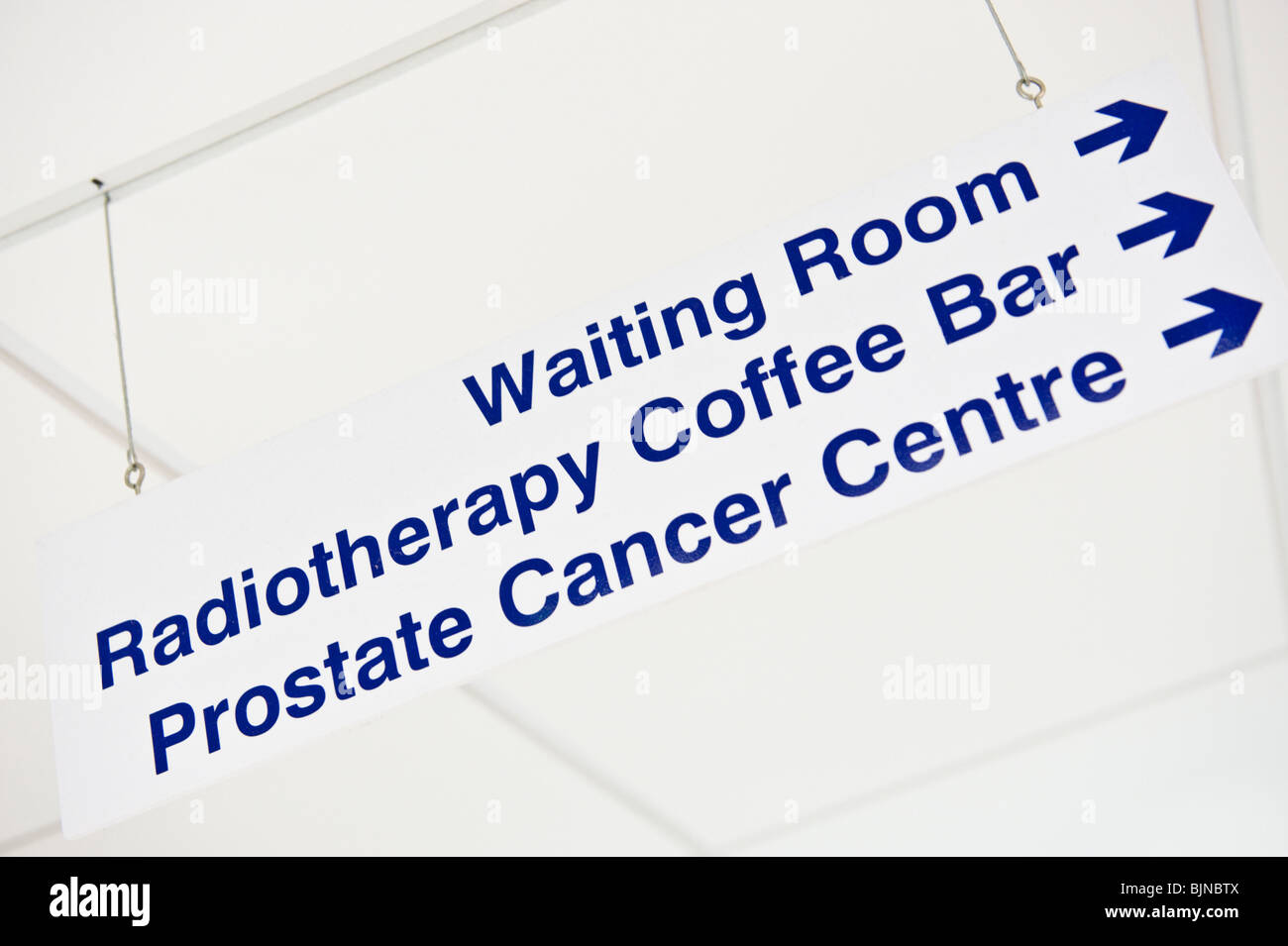 A hospital sign hanging from a ceiling in a corridor Stock Photo - Alamy