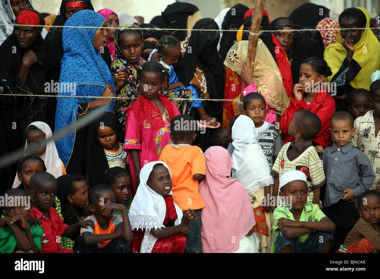 Swahili women some wearing traditional dress watching the traditional ...