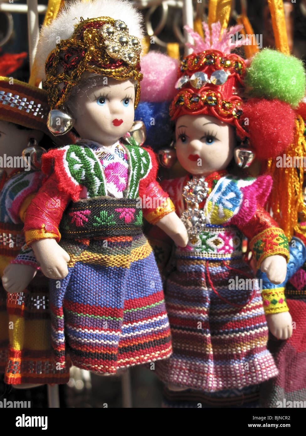 Traditional dolls hang in the Barkhor market in Lhasa, Tibet Stock ...