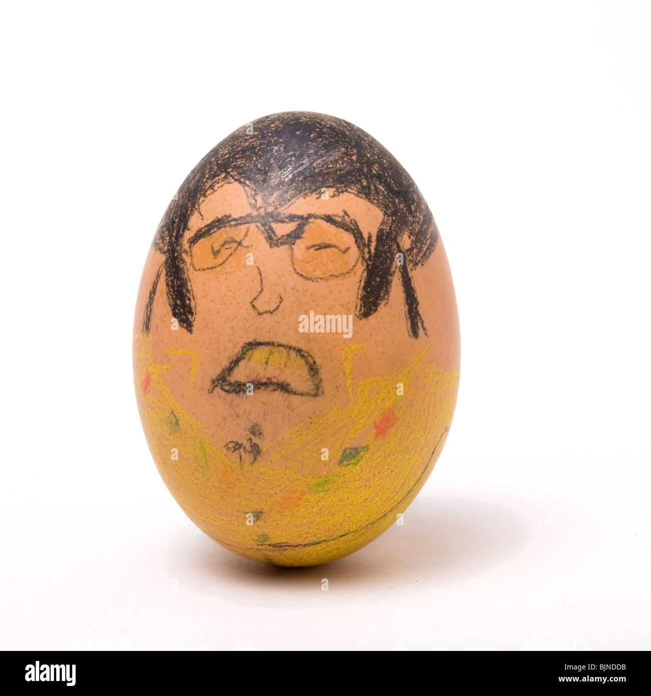Childs decorated egg for easter of Elvis Presley isolated against white ...