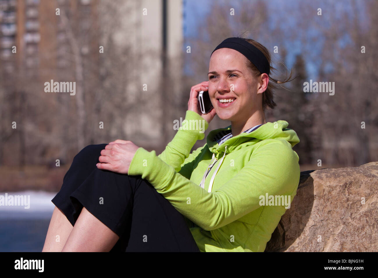 Young woman relaxing outdoor and talking on a cellphone Stock Photo - Alamy