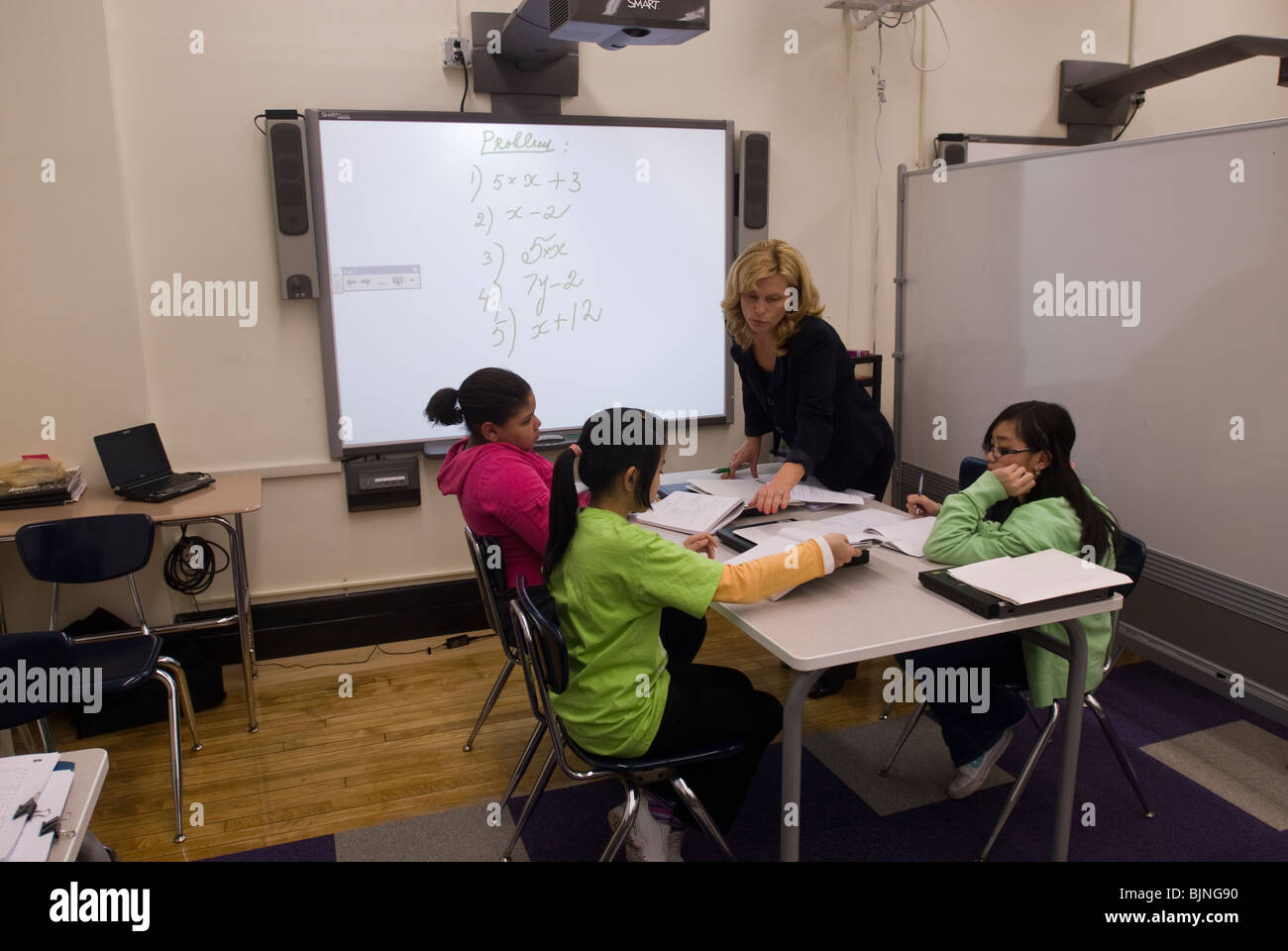 A whiteboard is used in a technology driven after-school math program ...