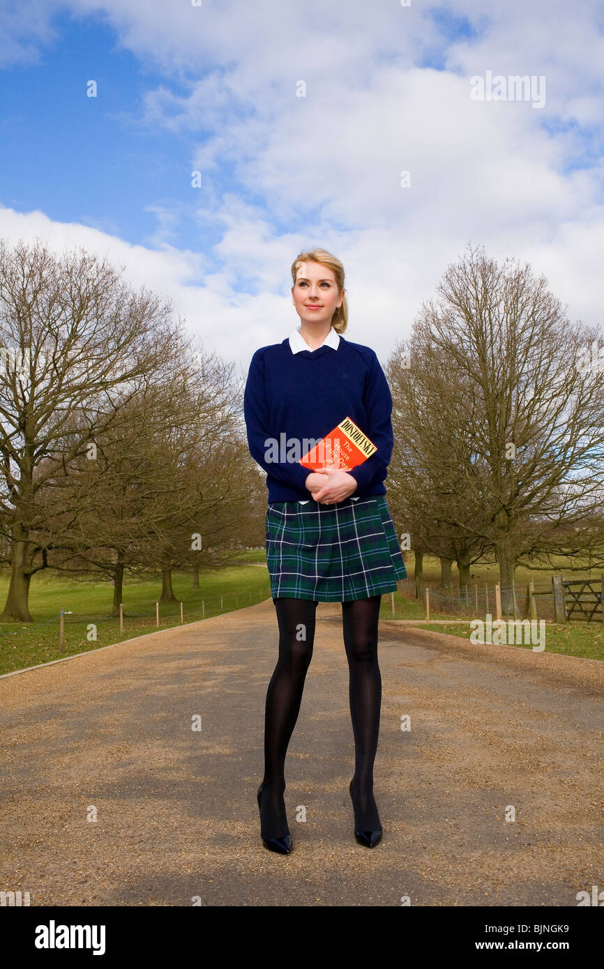 A blond woman in a schoolgirl uniform outside wearing a pair of ...