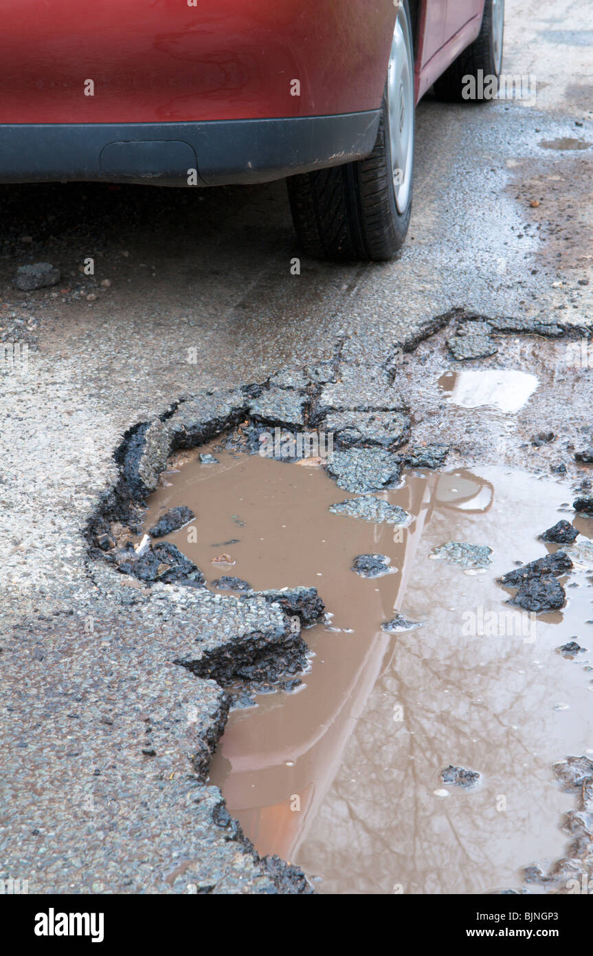 Pothole road hi-res stock photography and images - Alamy