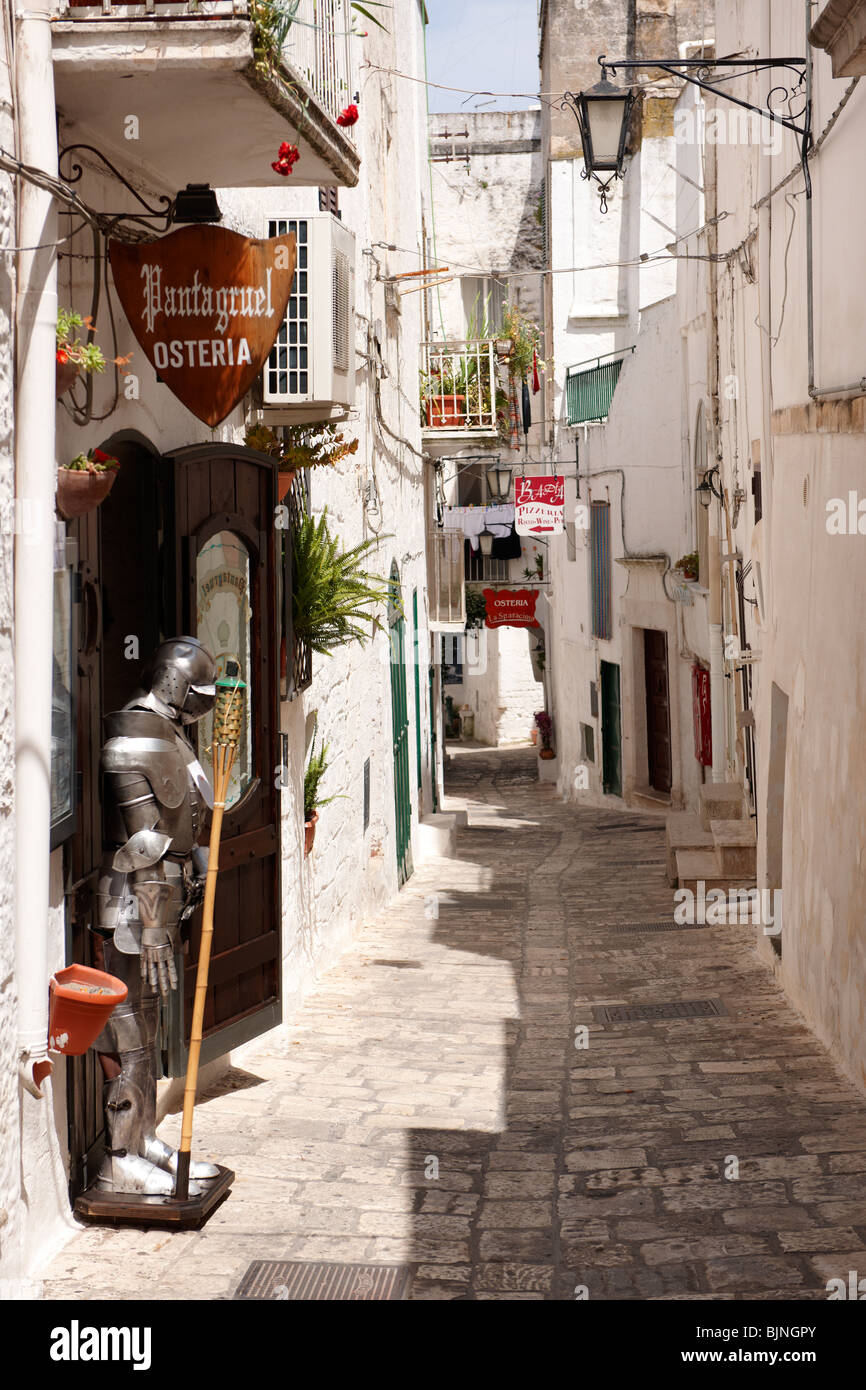 The alleys and narrow streets of the white city of Ostuni, Puglia ...