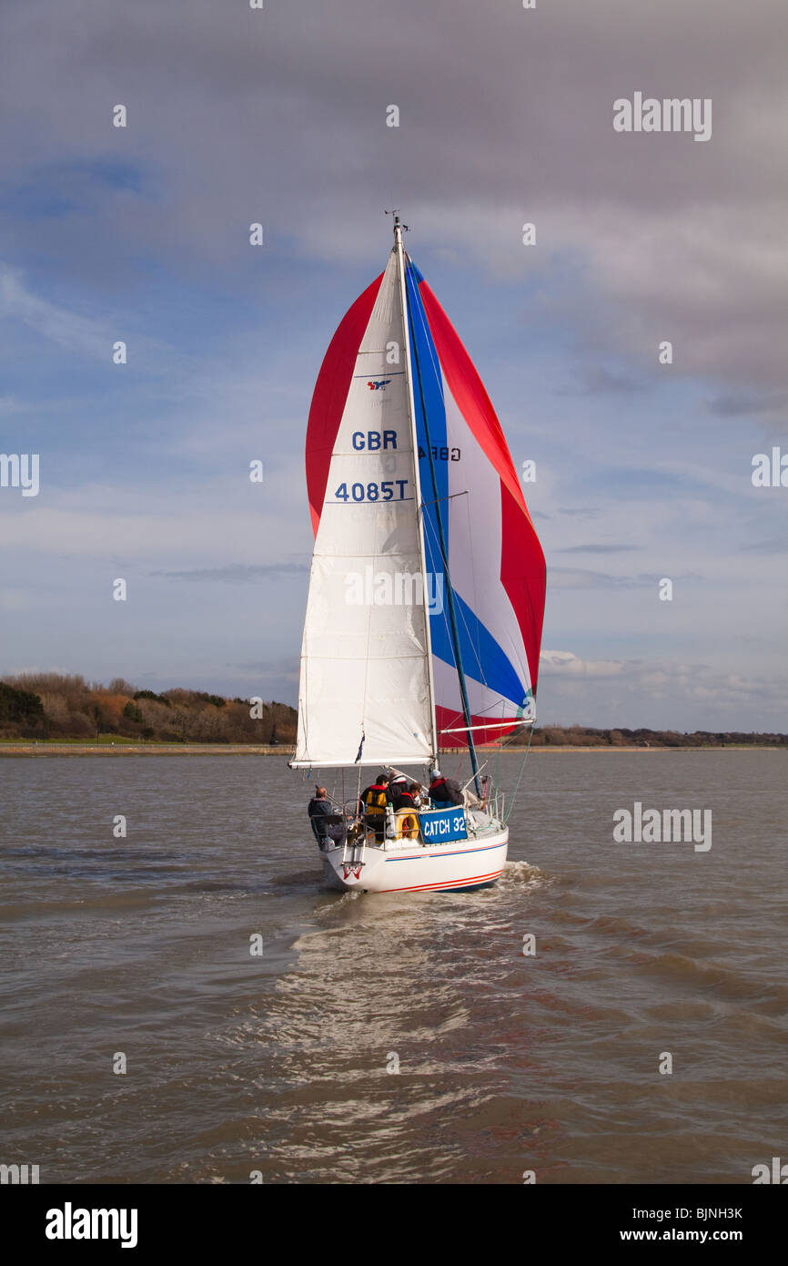 Sailing boat flying spinaker Stock Photo - Alamy