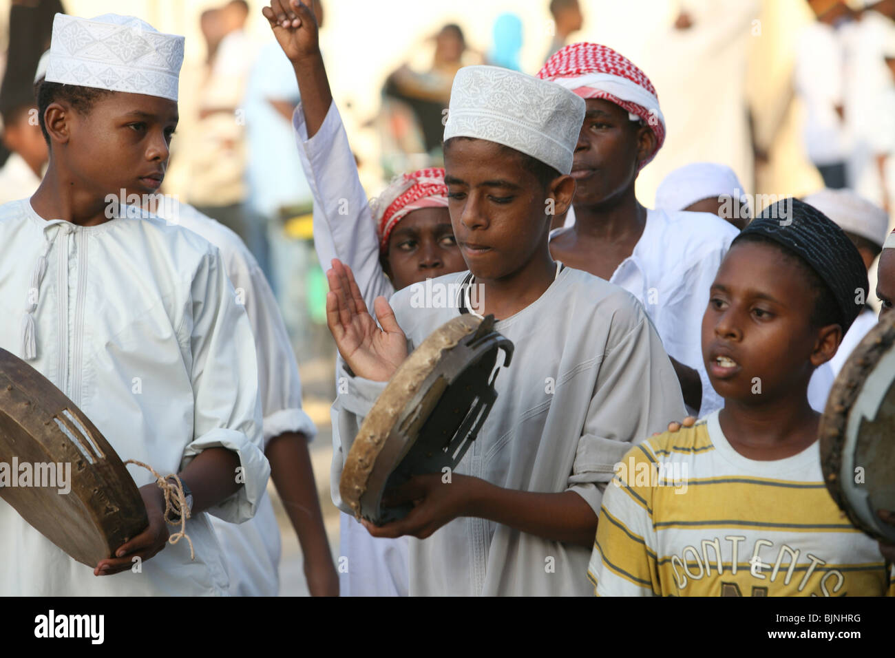 Men playing the kidafi tambourine during the Maulidi festival in ...