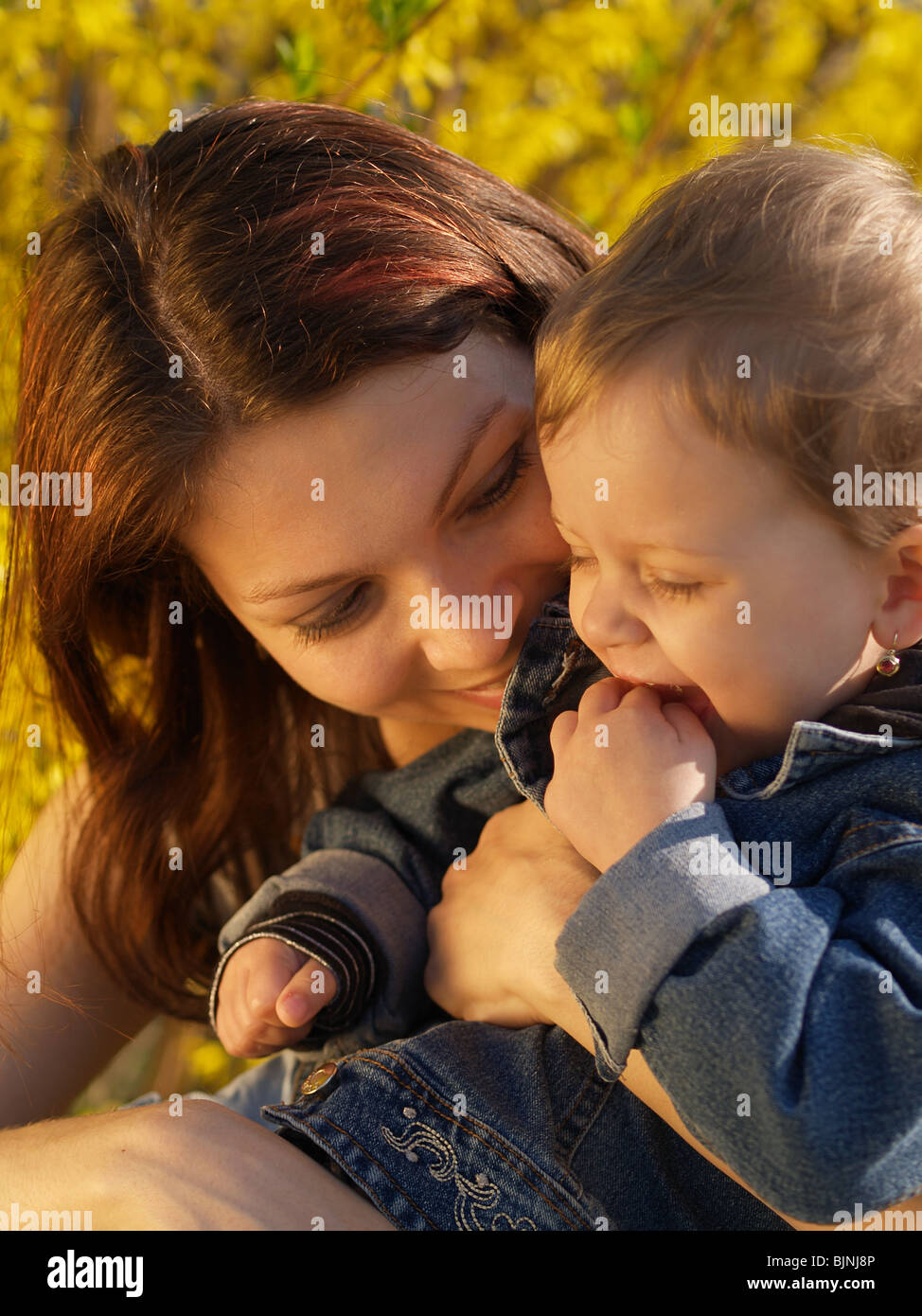 Mother with baby indoor Stock Photo - Alamy