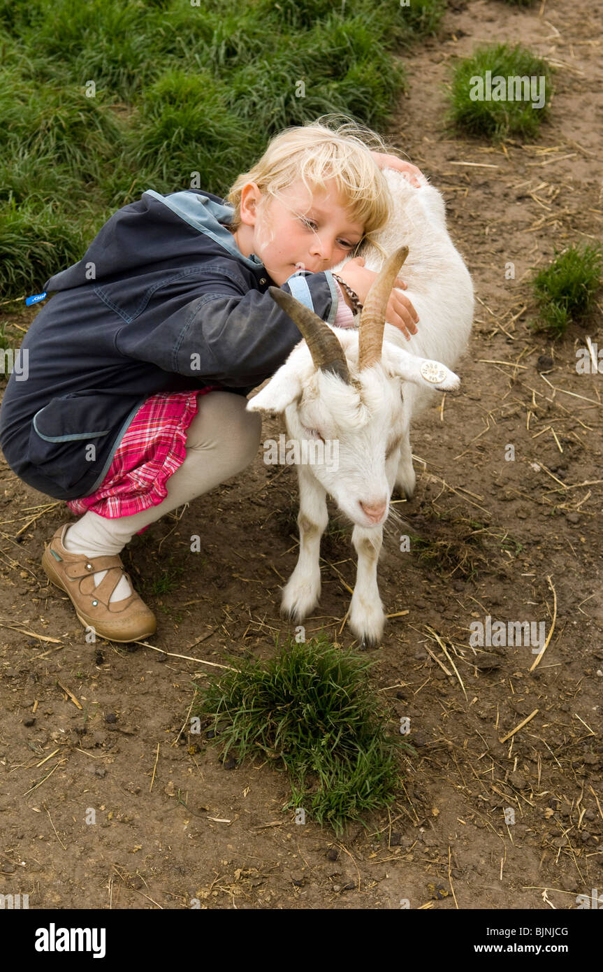 Girl with a small goat Stock Photo - Alamy