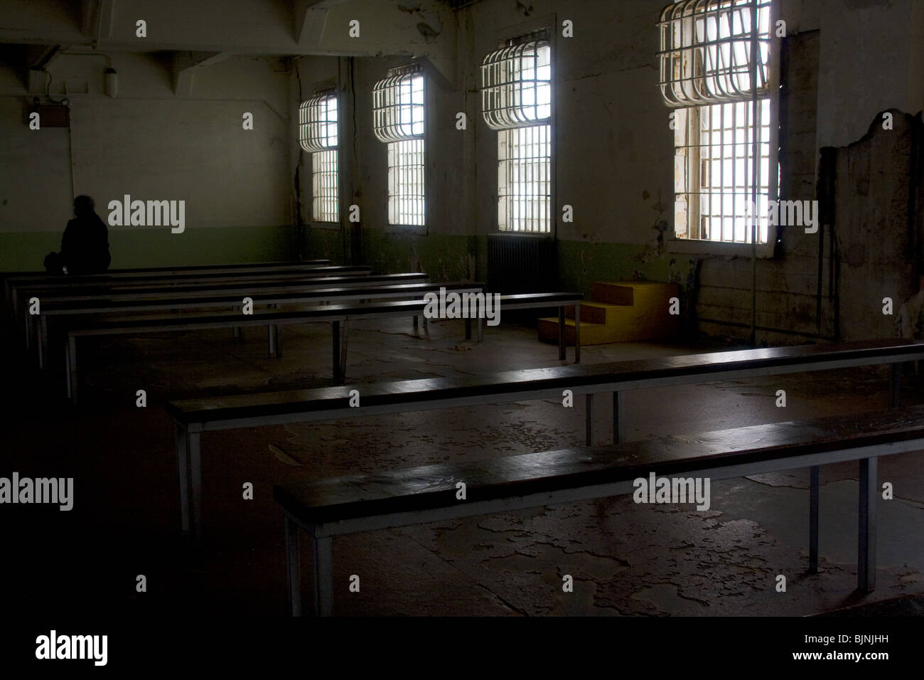 A visitor sits in the dining area of Alcatraz, San Francisco Stock ...