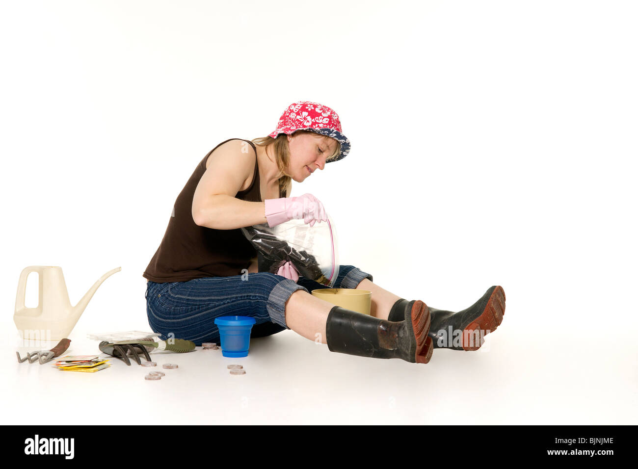 Woman wearing rubber boots Cut Out Stock Images & Pictures - Alamy