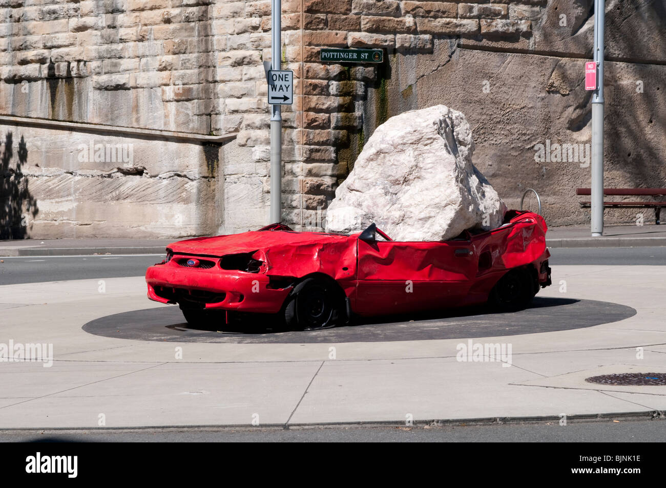 Public art showing a car smashed by a rock, the Rocks, Sydney ...