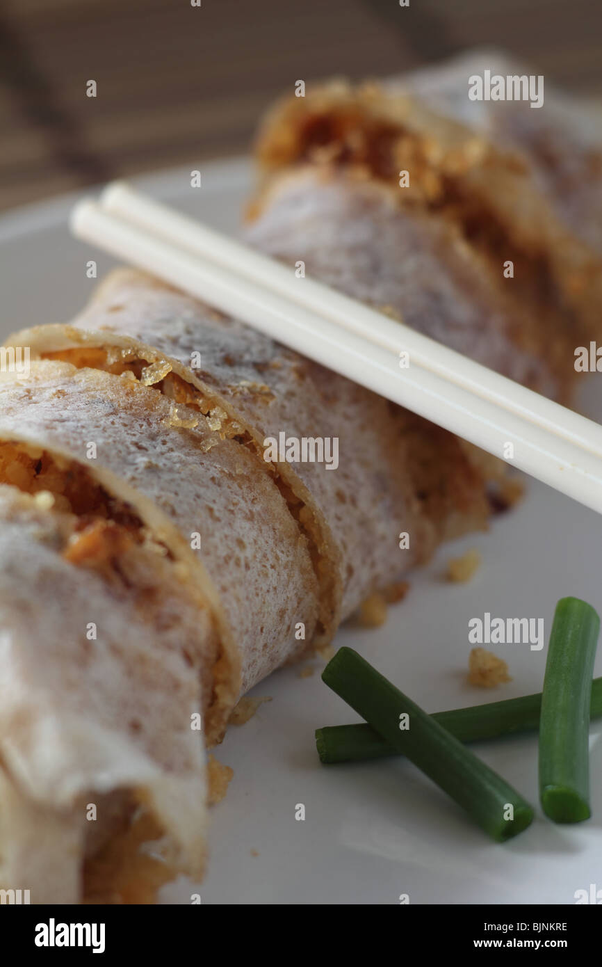 Poh pia or piah, Asian stuffed pancake on plate with chopsticks Stock ...