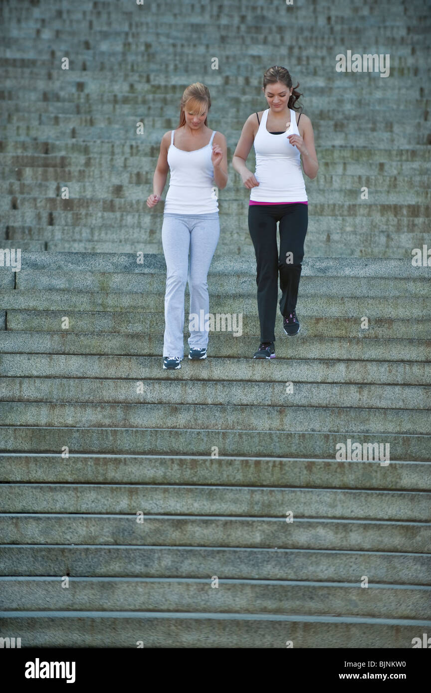 Women walking stairs steps sunny hi-res stock photography and images ...