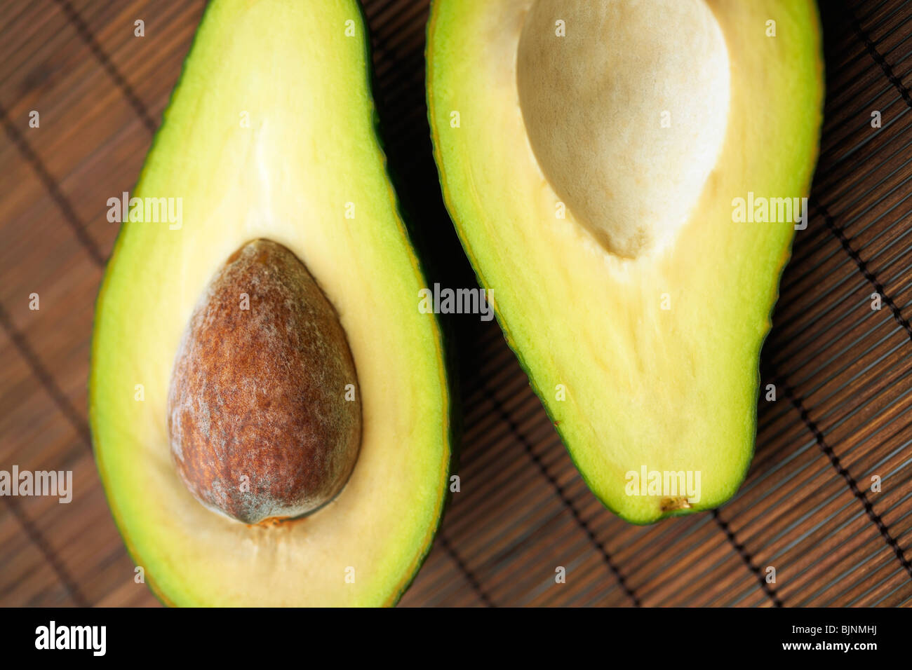 Close-up avocado sliced in half Stock Photo - Alamy