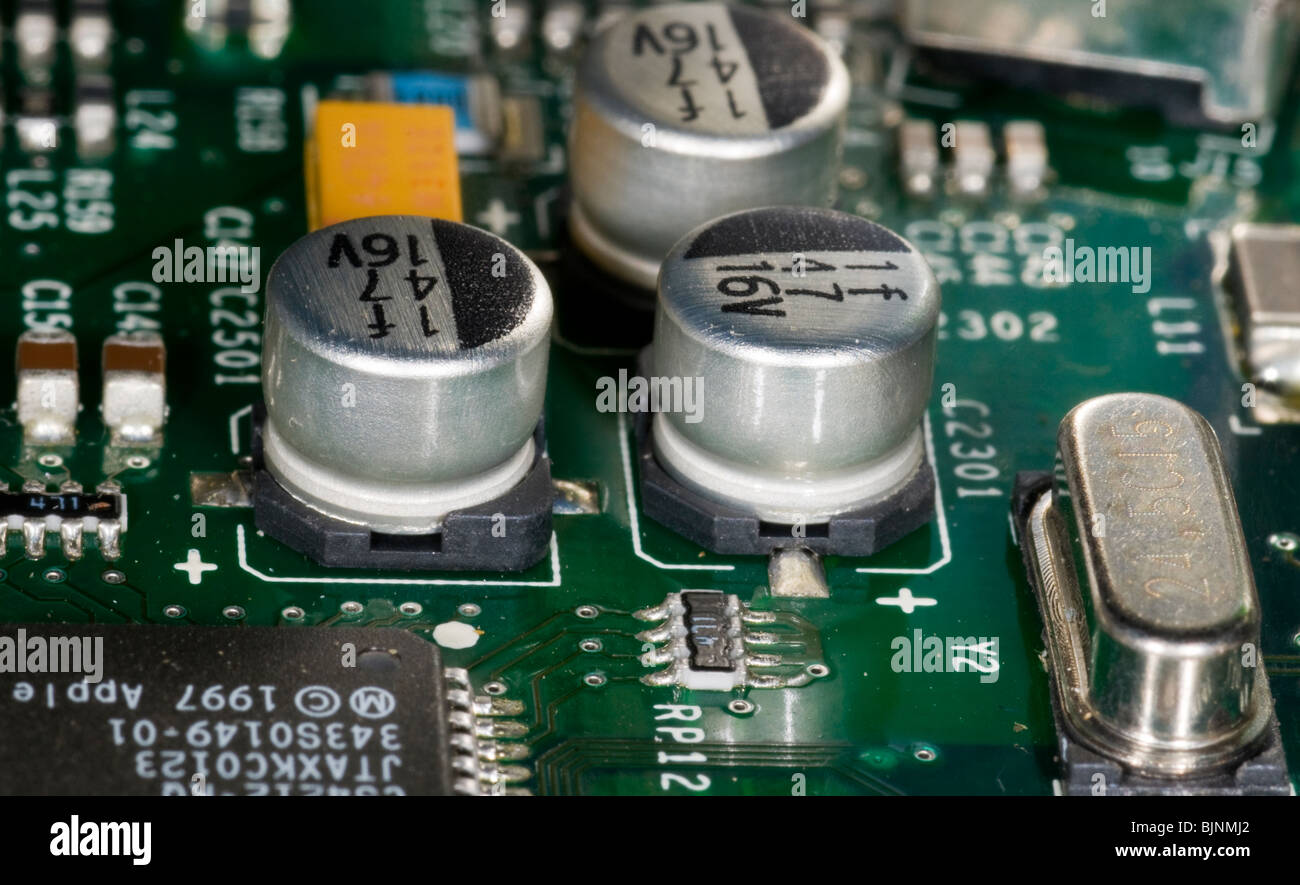 close up photograph of electronic components on a computer mother board ...