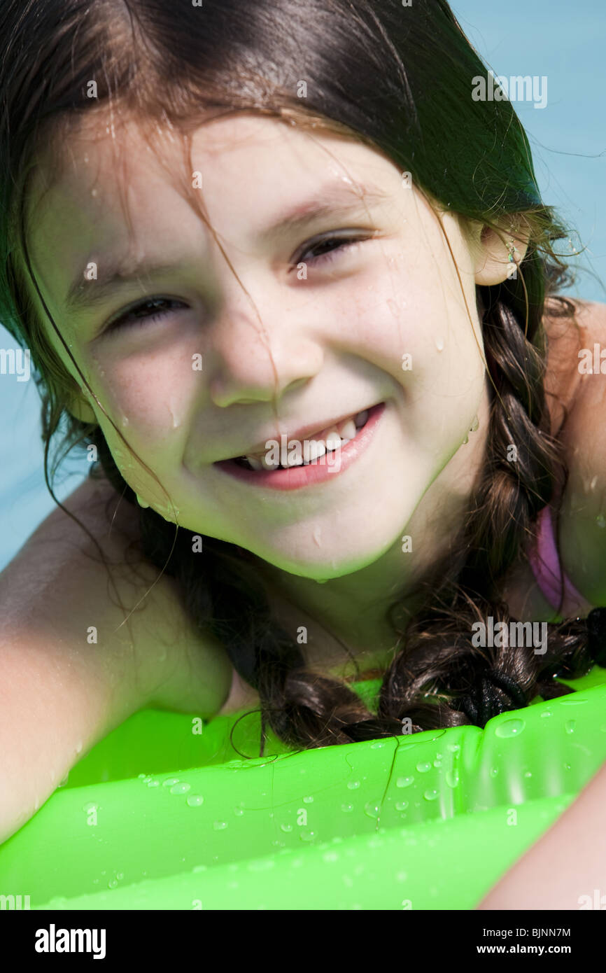 Girl on floatation device Stock Photo - Alamy